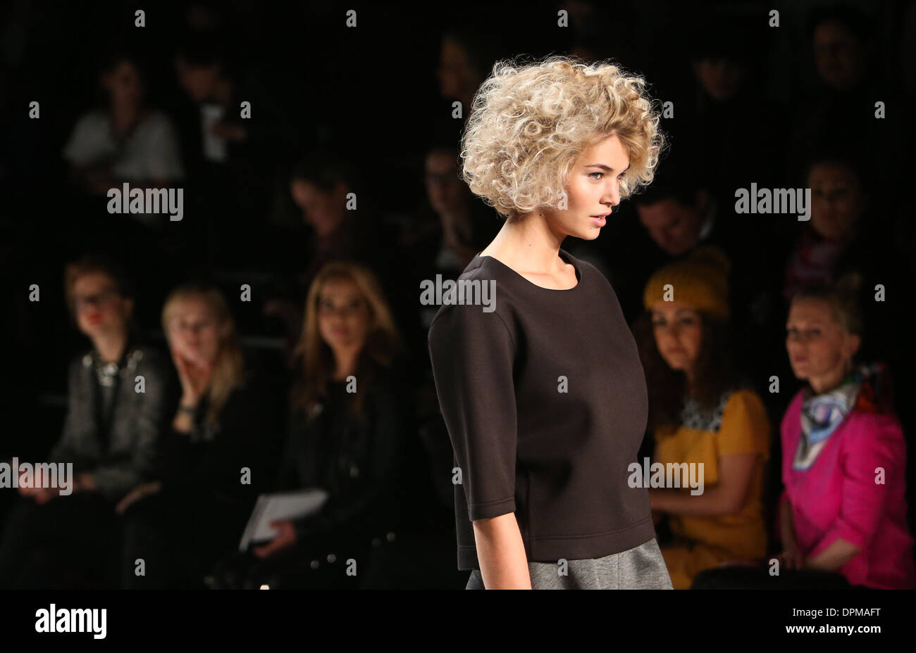 Berlin, Germany. 15th Jan, 2014. A model displays a creation by German ...