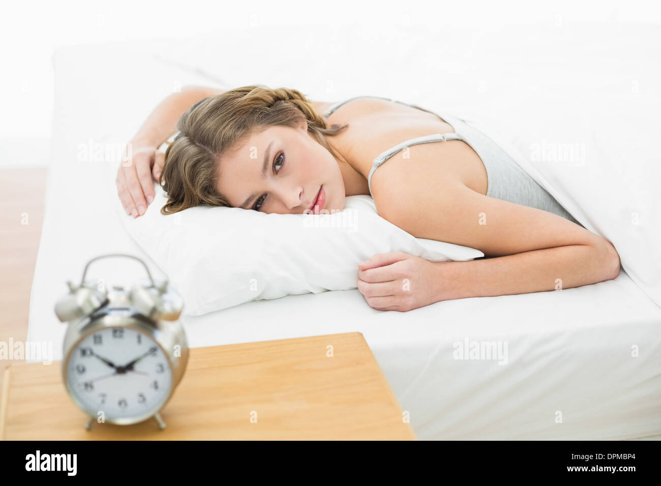 Pretty young woman just waking up Stock Photo - Alamy
