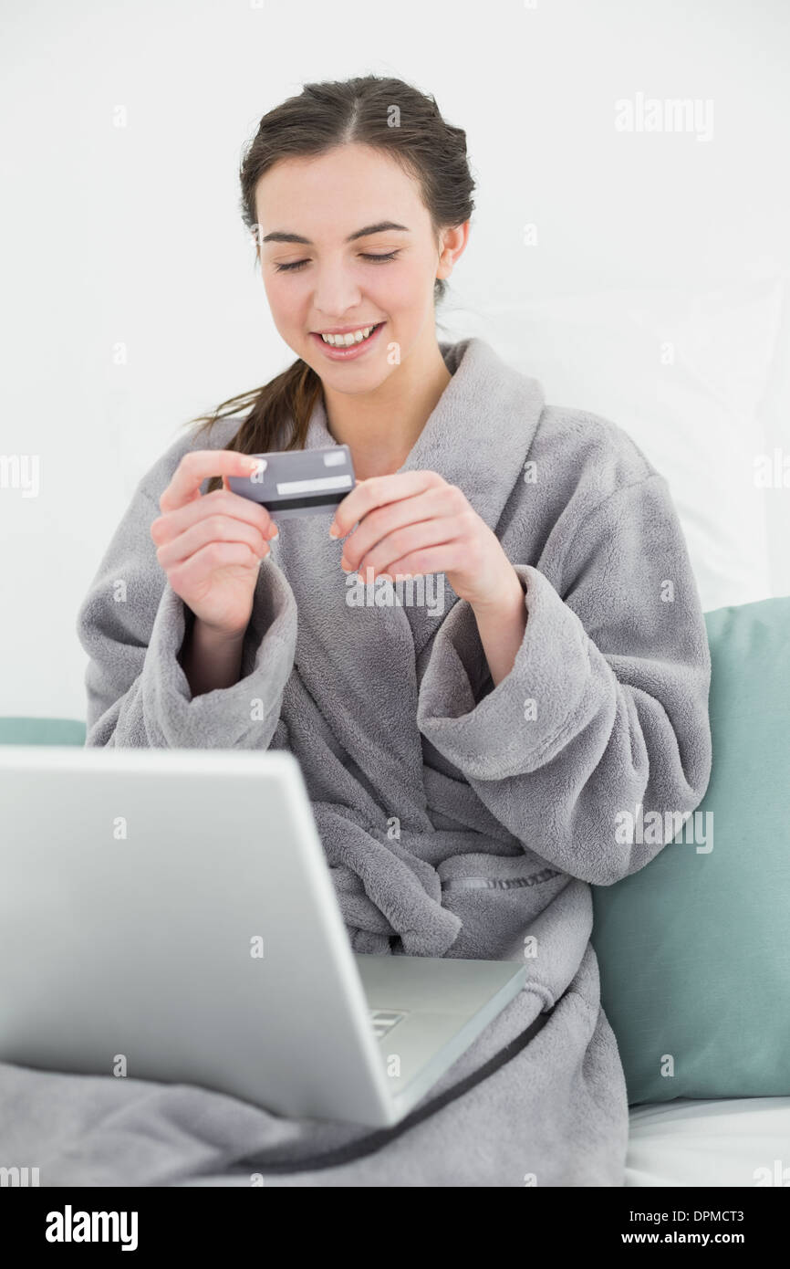 Young woman in bathrobe browsing hi-res stock photography and images ...