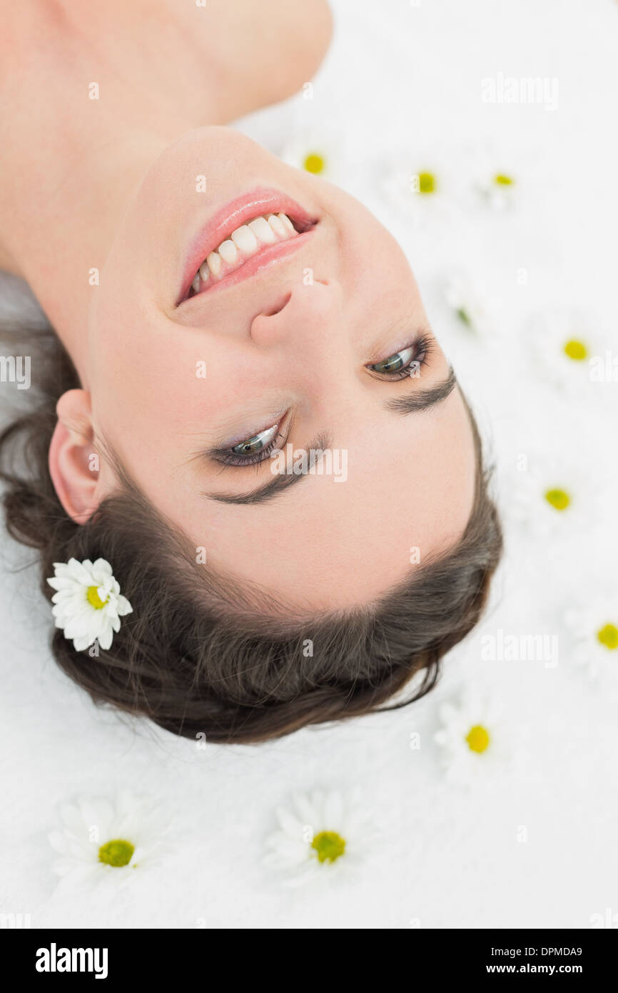 Beautiful young woman with flowers in beauty salon Stock Photo - Alamy
