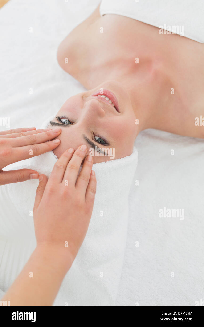 Hands massaging woman's forehead at beauty spa Stock Photo - Alamy