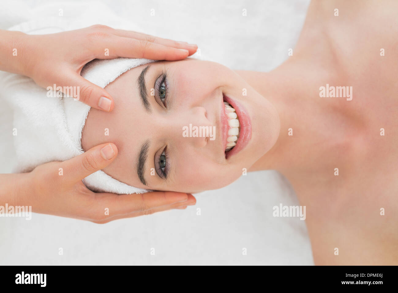 Hands massaging woman's forehead at beauty spa Stock Photo - Alamy