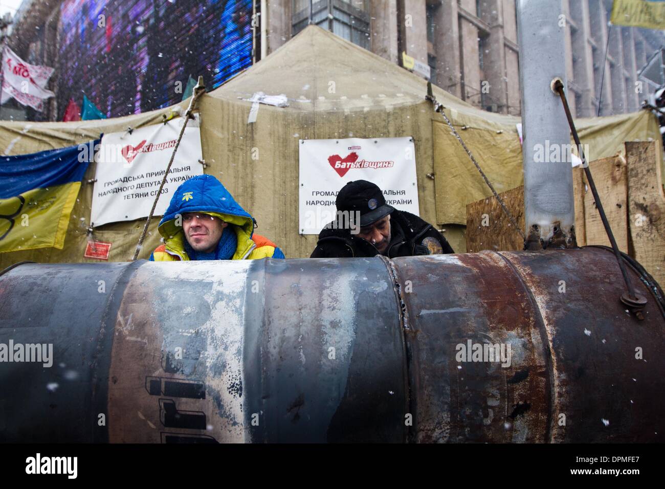 Kiev, Ukraine. 13th Jan, 2014. Protesters from Euromaidan face the ...