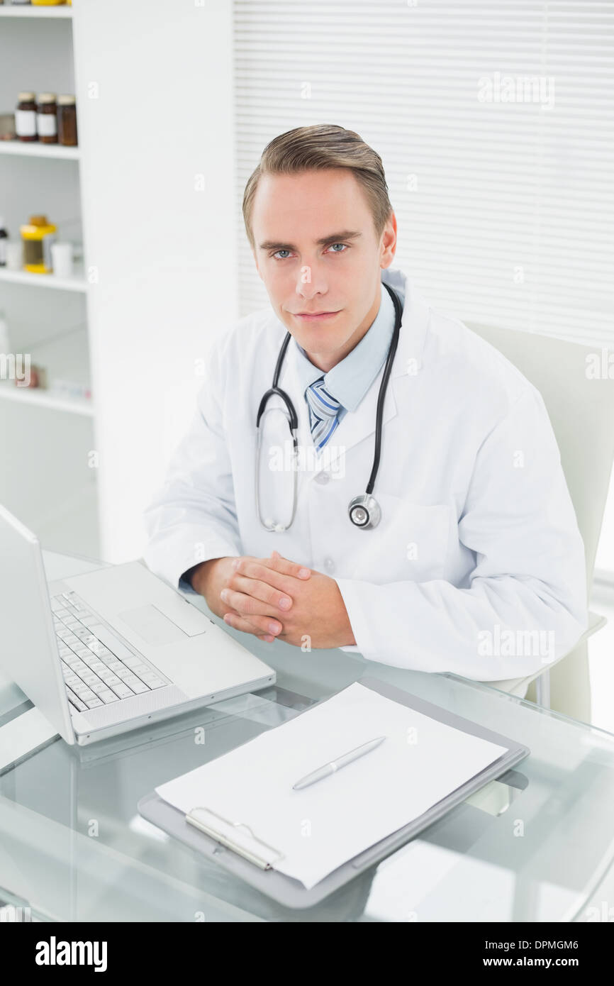 Male doctor laptop looking camera hi-res stock photography and images ...