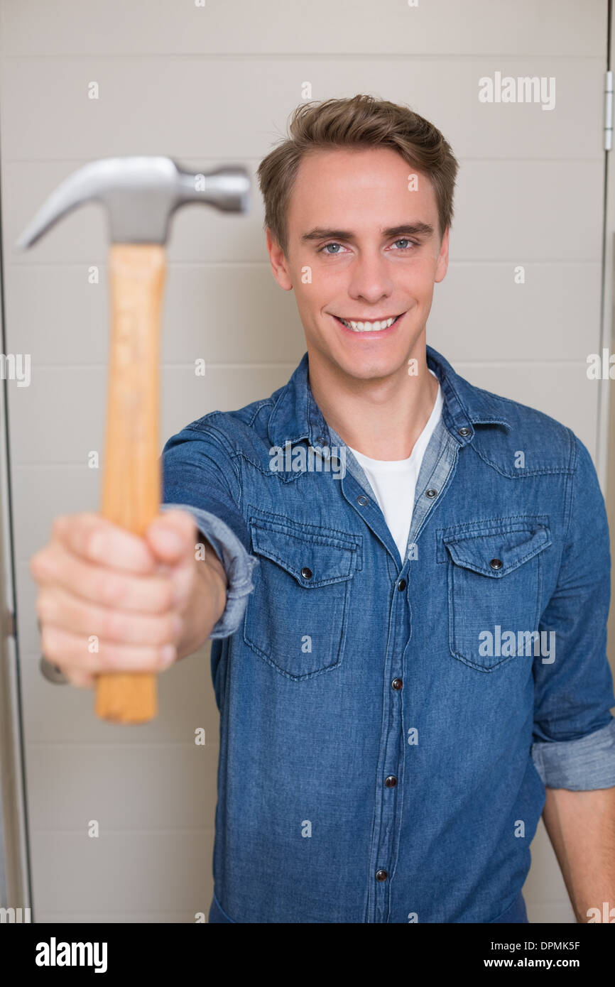Young man with hammer hi-res stock photography and images - Alamy