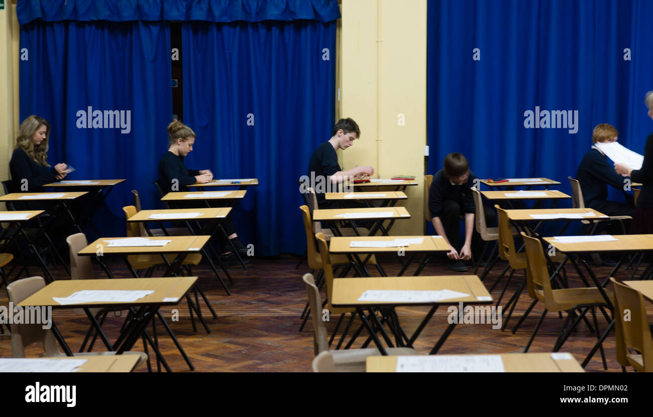 Welsh teenage GCSE school pupils sitting exams in a school hall, Wales ...