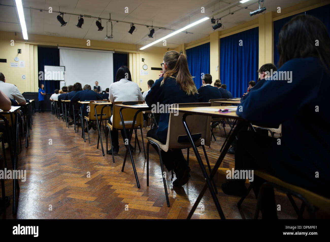 Welsh teenage GCSE school pupils sitting exams in a school hall, Wales ...