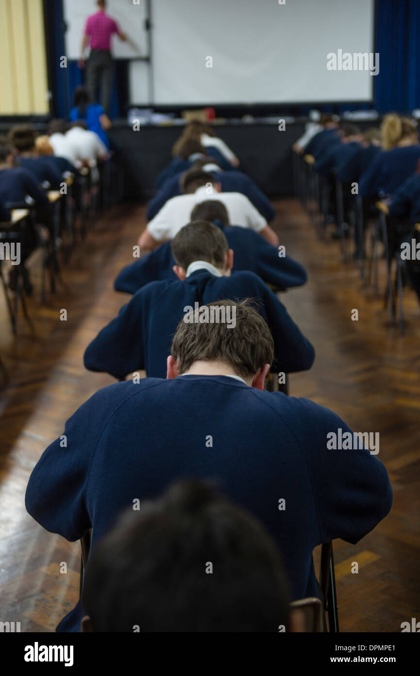 Welsh teenage GCSE school pupils sitting exams in a school hall, Wales ...