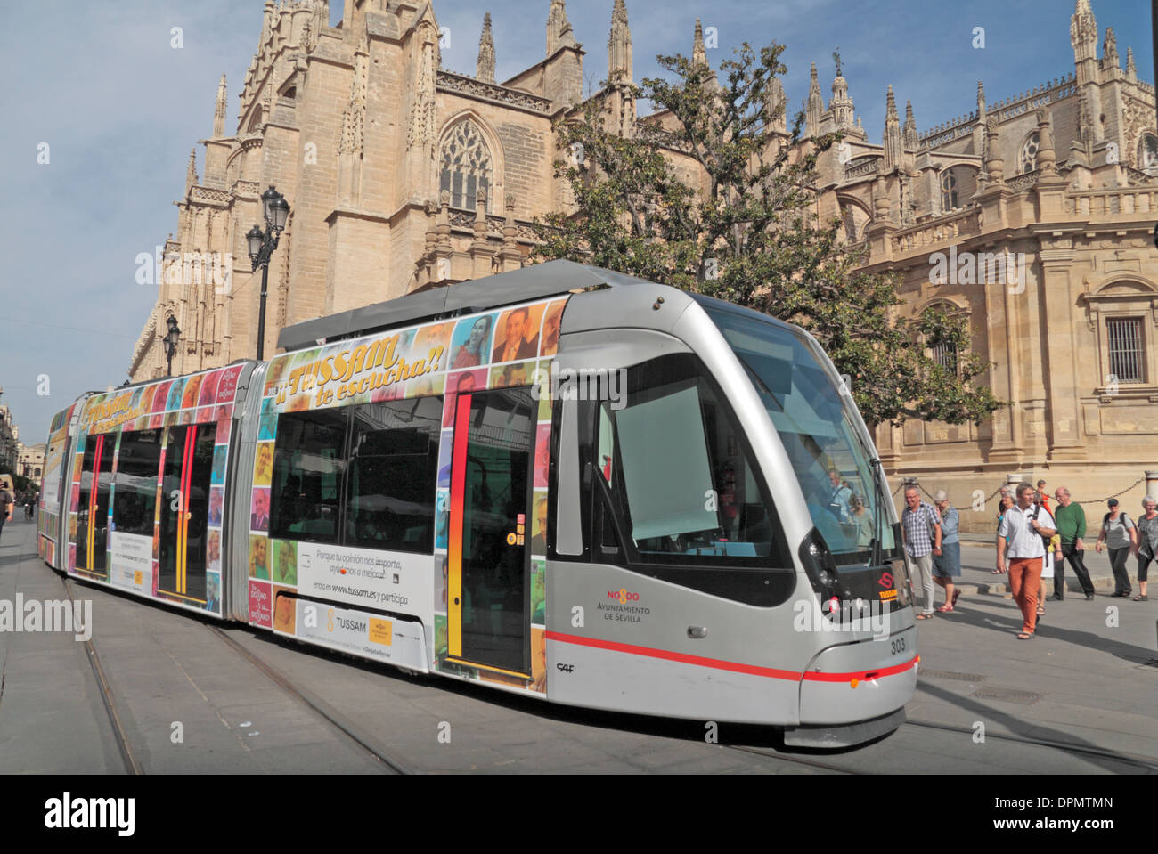 Tram passing Seville Cathedral on Avenue de la Constitución in Seville ...