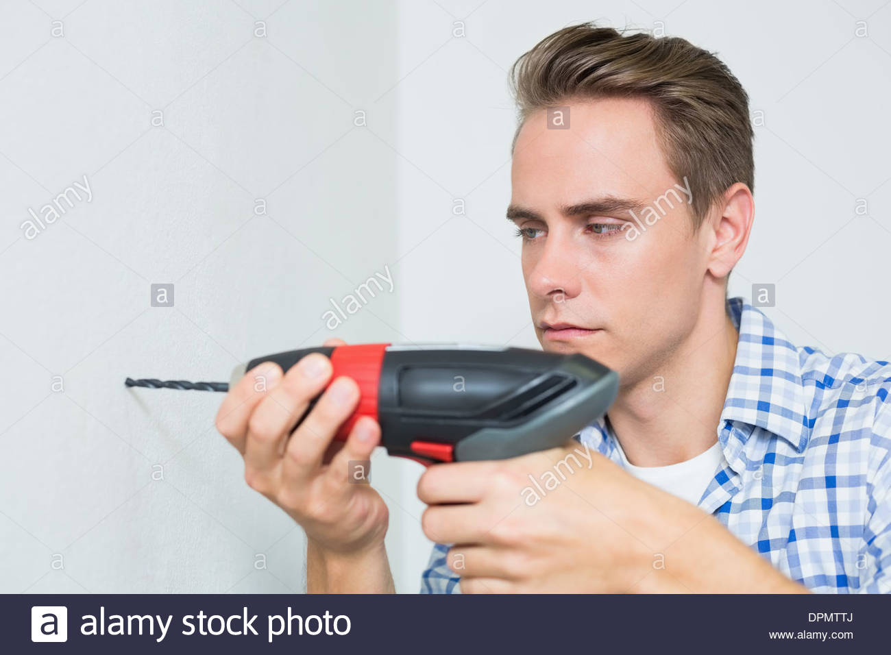 Man wall drill hi-res stock photography and images - Alamy