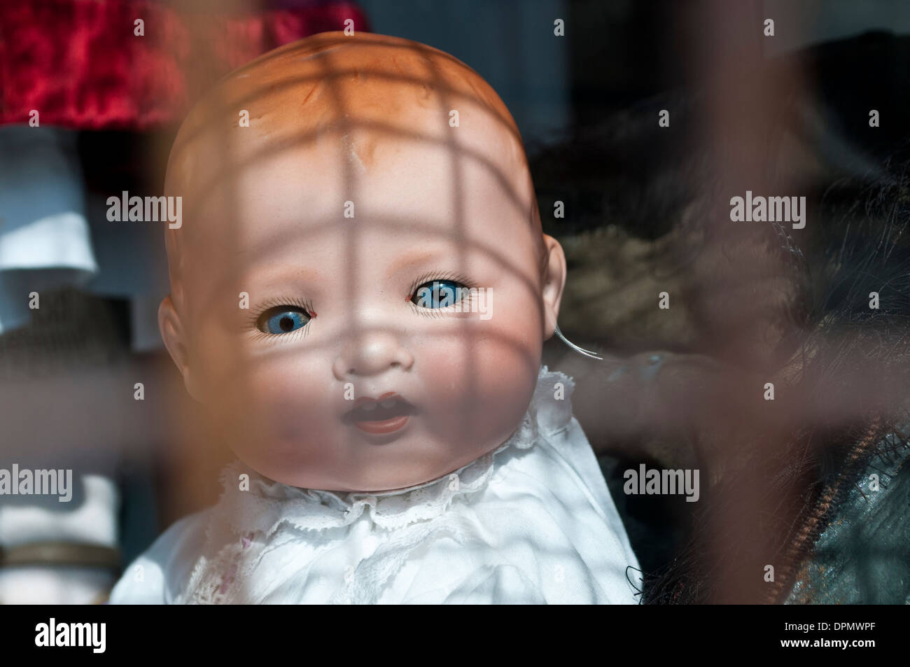 Doll with shadows on her face Stock Photo - Alamy