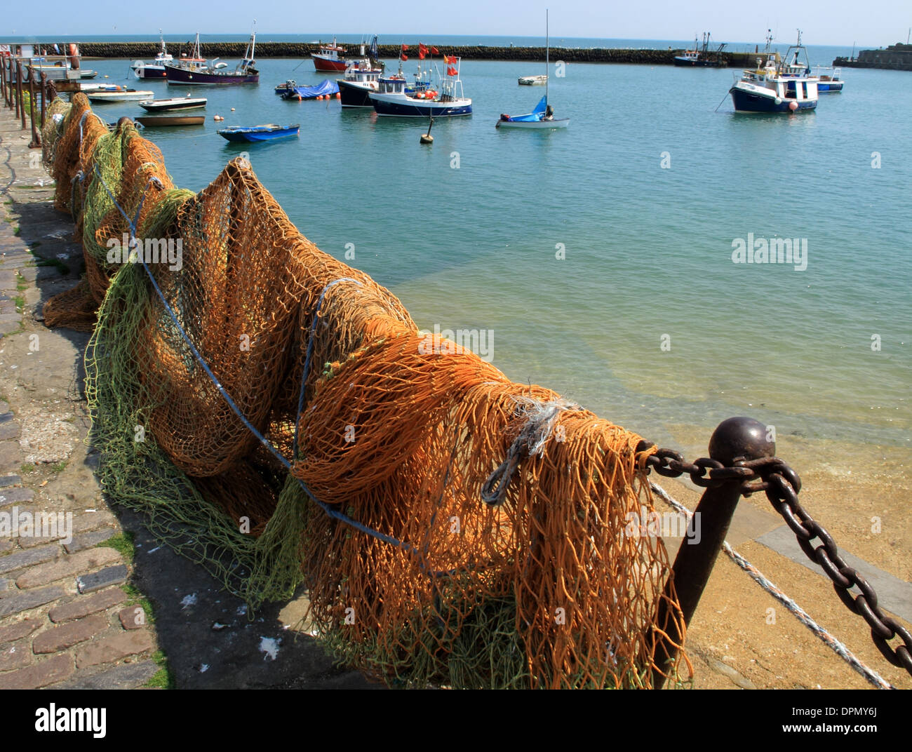 An image showing the fishing nets by the harbour side Stock Photo - Alamy