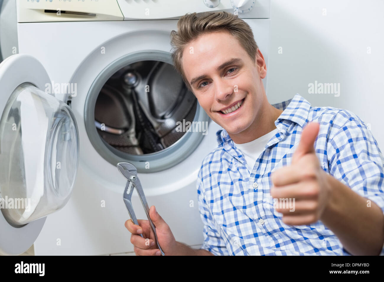 Repairing washing machine hi-res stock photography and images - Alamy