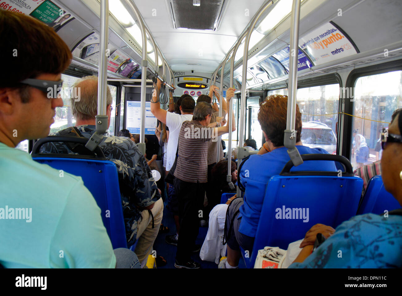 Miami Beach Florida,public bus,coach,riders,passenger passengers rider ...