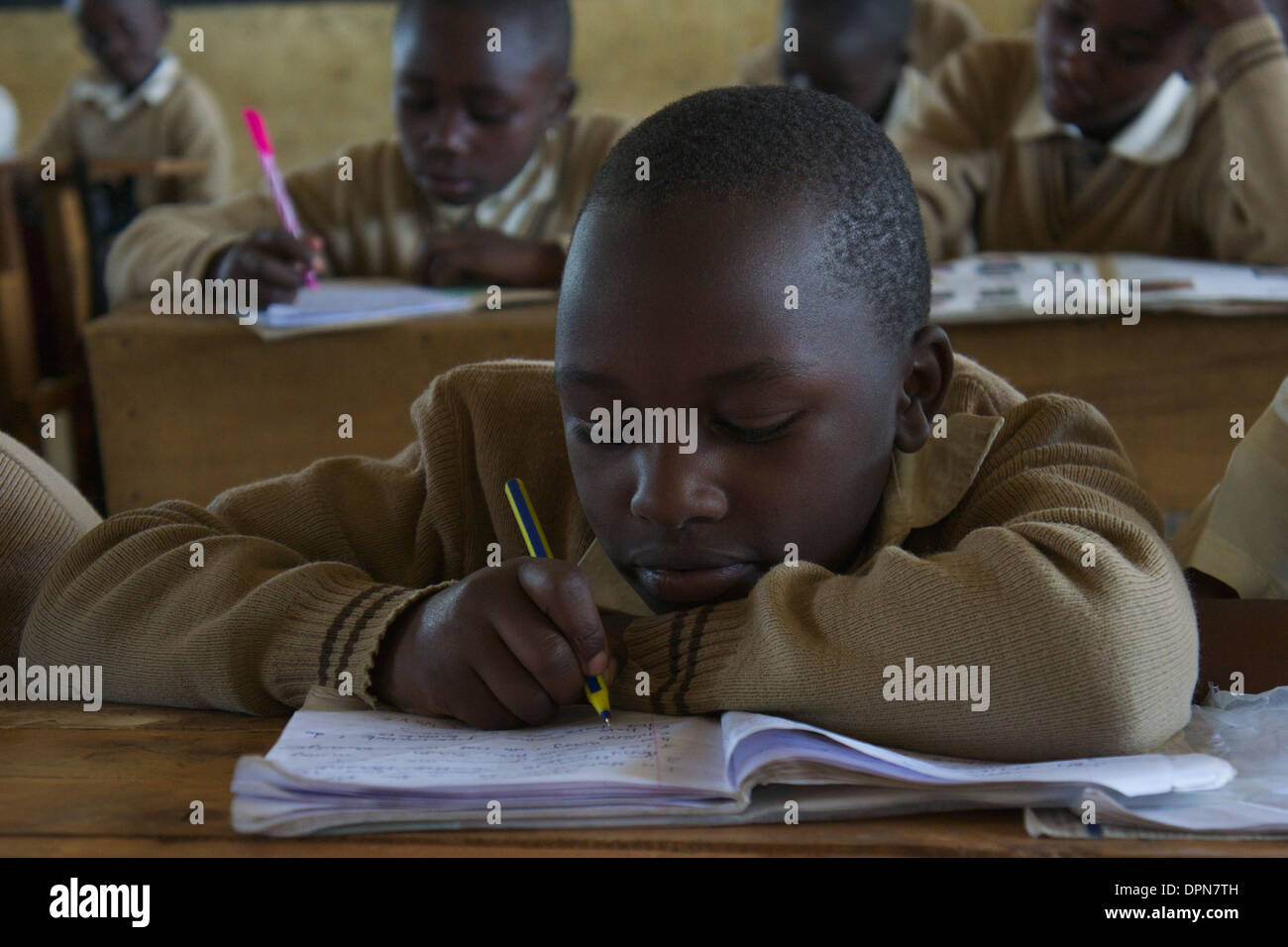 African school child in school writing hi-res stock photography and ...