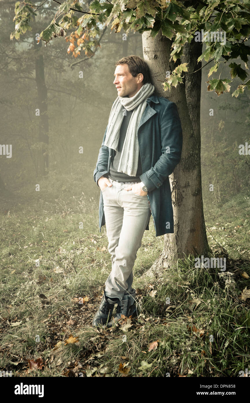 Person Leaning Against A Tree