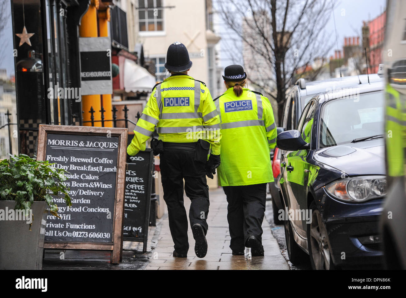Police officer and a Police Community Support Officer walking the beat ...