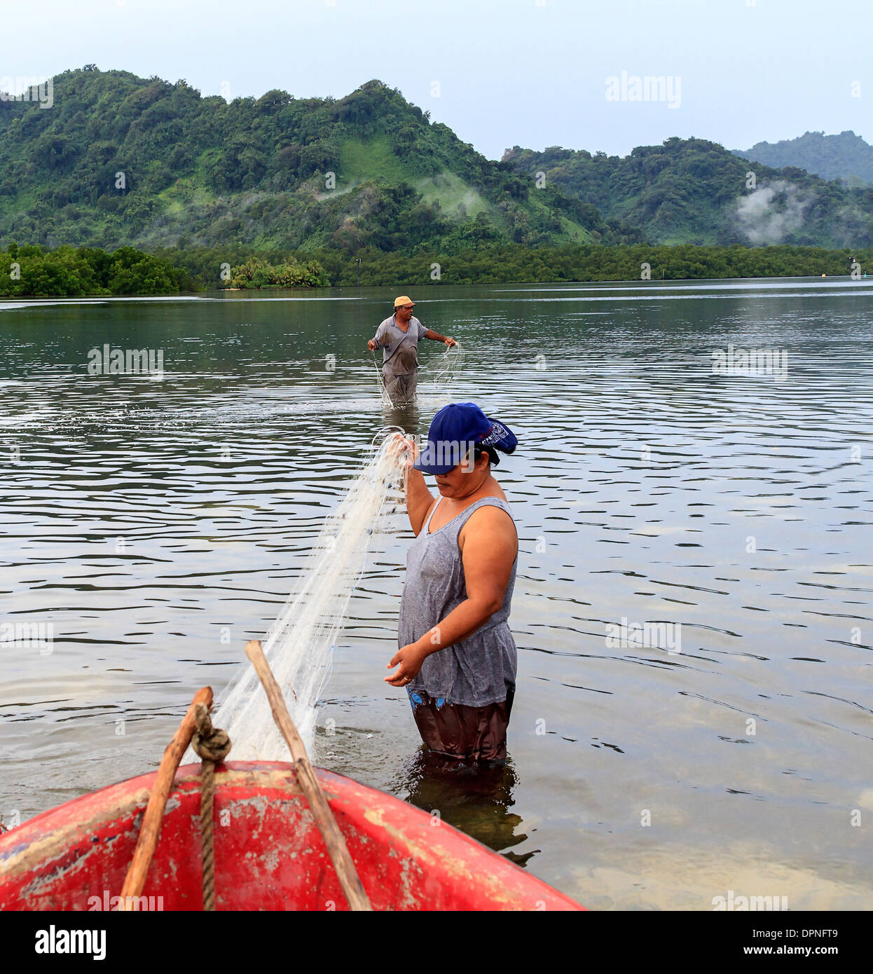 Fishing by net in shallow waters off the beach in Kosrae, Micronesia ...