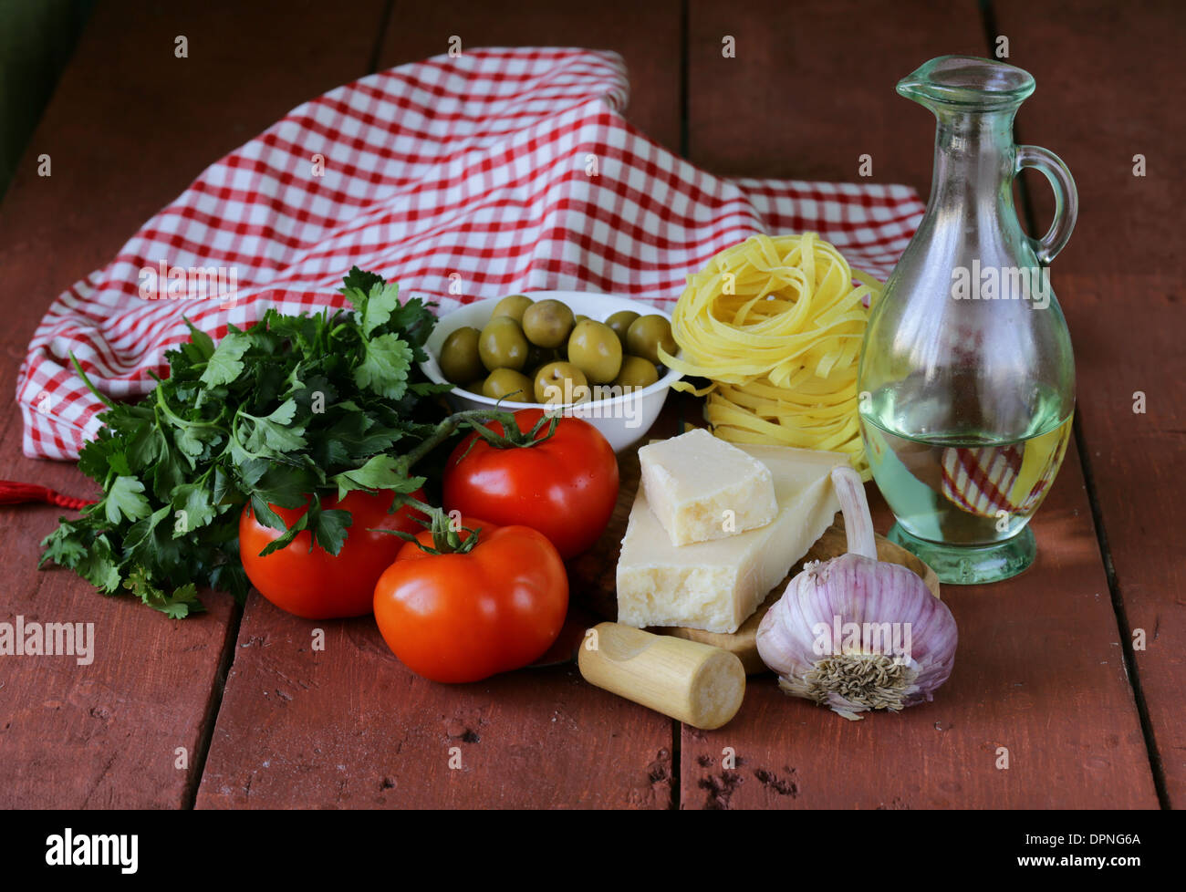 Italian still life - pasta, olive oil, tomatoes, garlic Stock Photo - Alamy