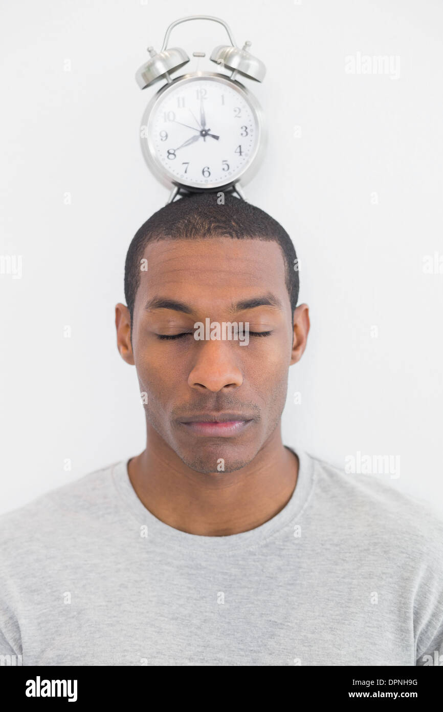 Man with clock hi-res stock photography and images - Alamy