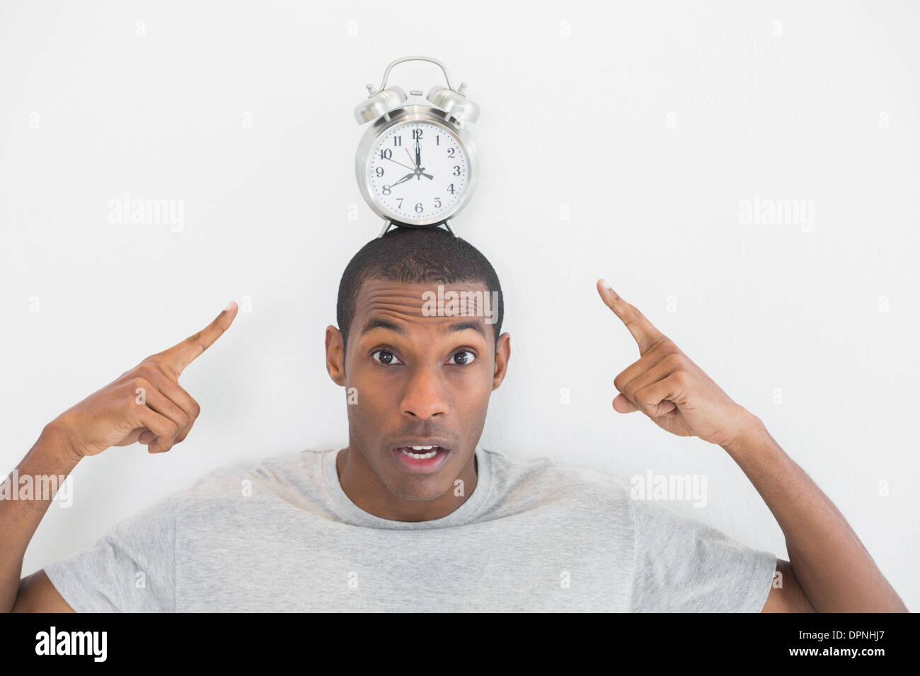 Pointing at clock hi-res stock photography and images - Alamy