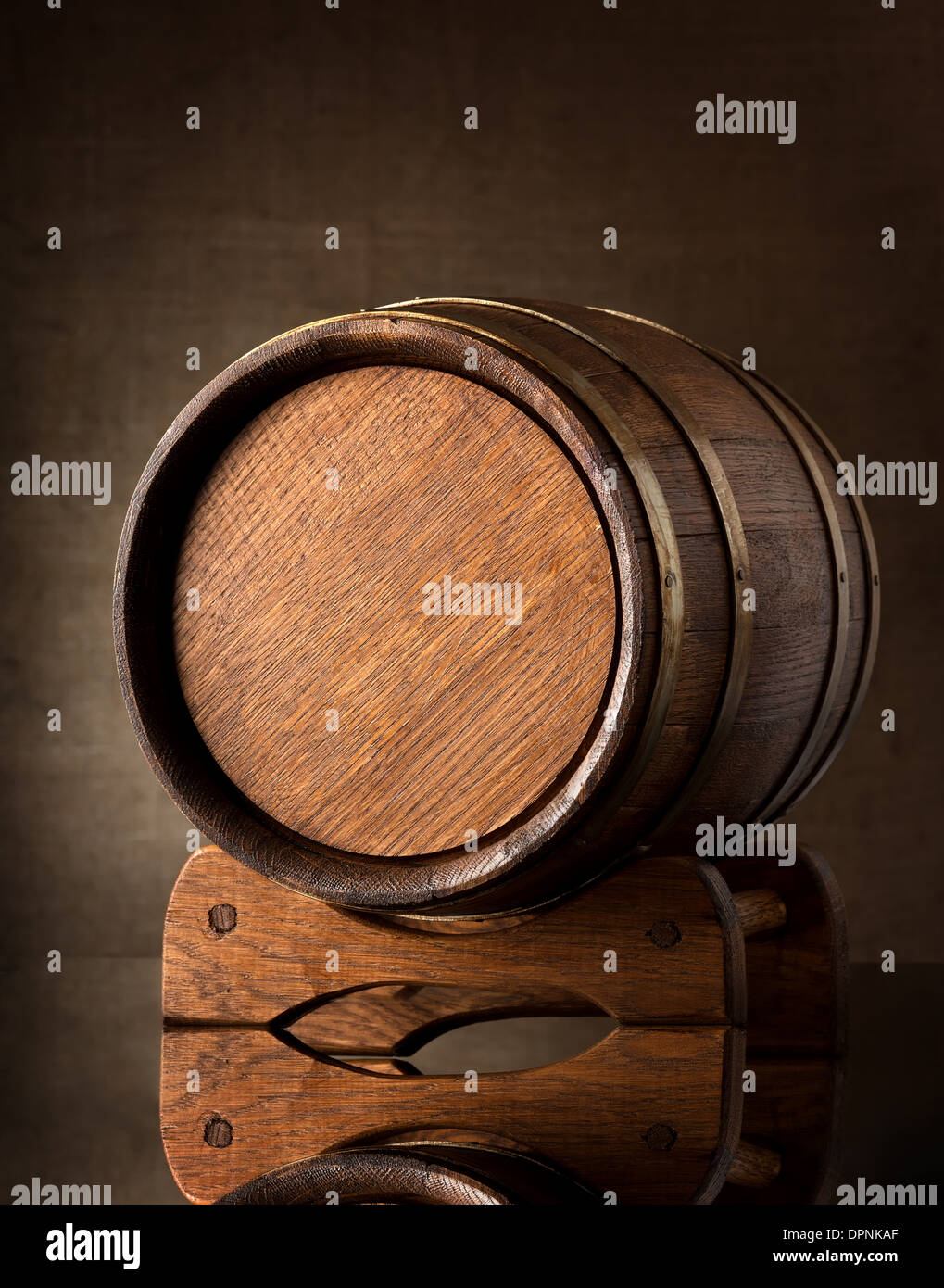 Old wooden barrel on a brown background Stock Photo - Alamy