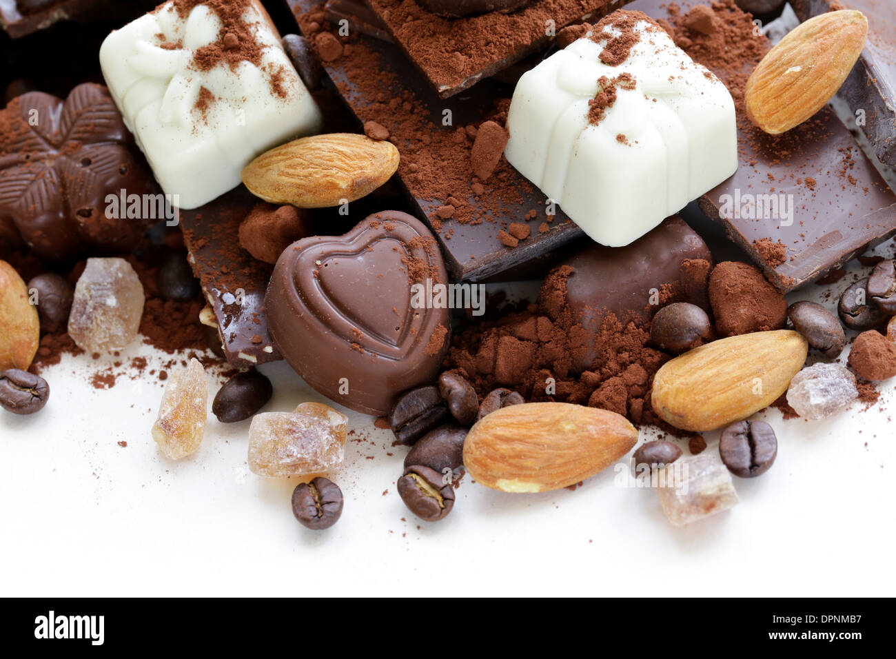 different varieties of chocolate and sweets on a white background Stock ...