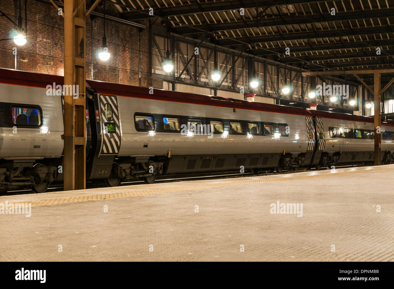 Virgin Trains Pendolino high speed train at night stopped in the ...
