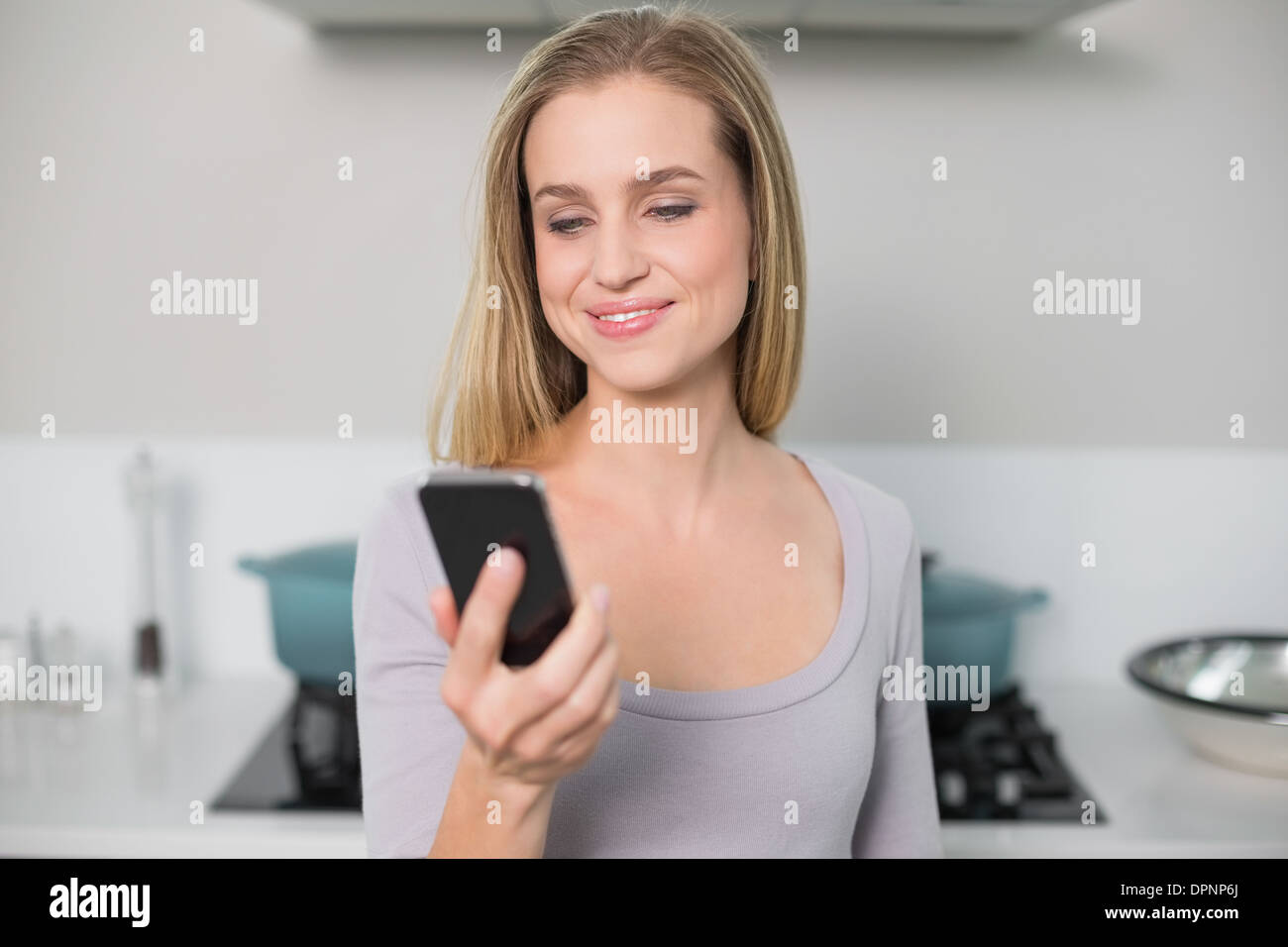 Model holding smartphone hi-res stock photography and images - Alamy