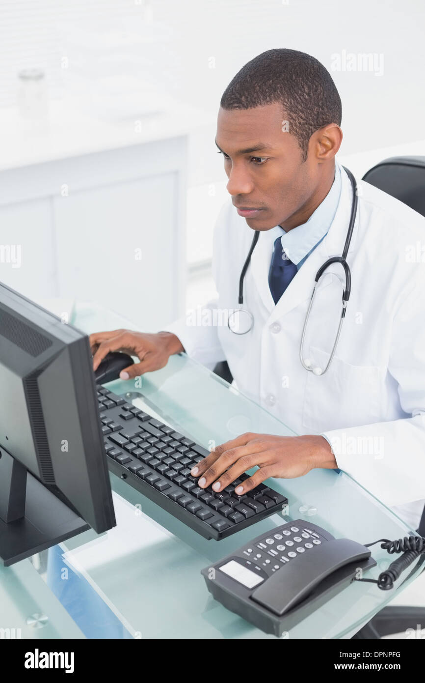 Doctor using computer at medical office Stock Photo - Alamy