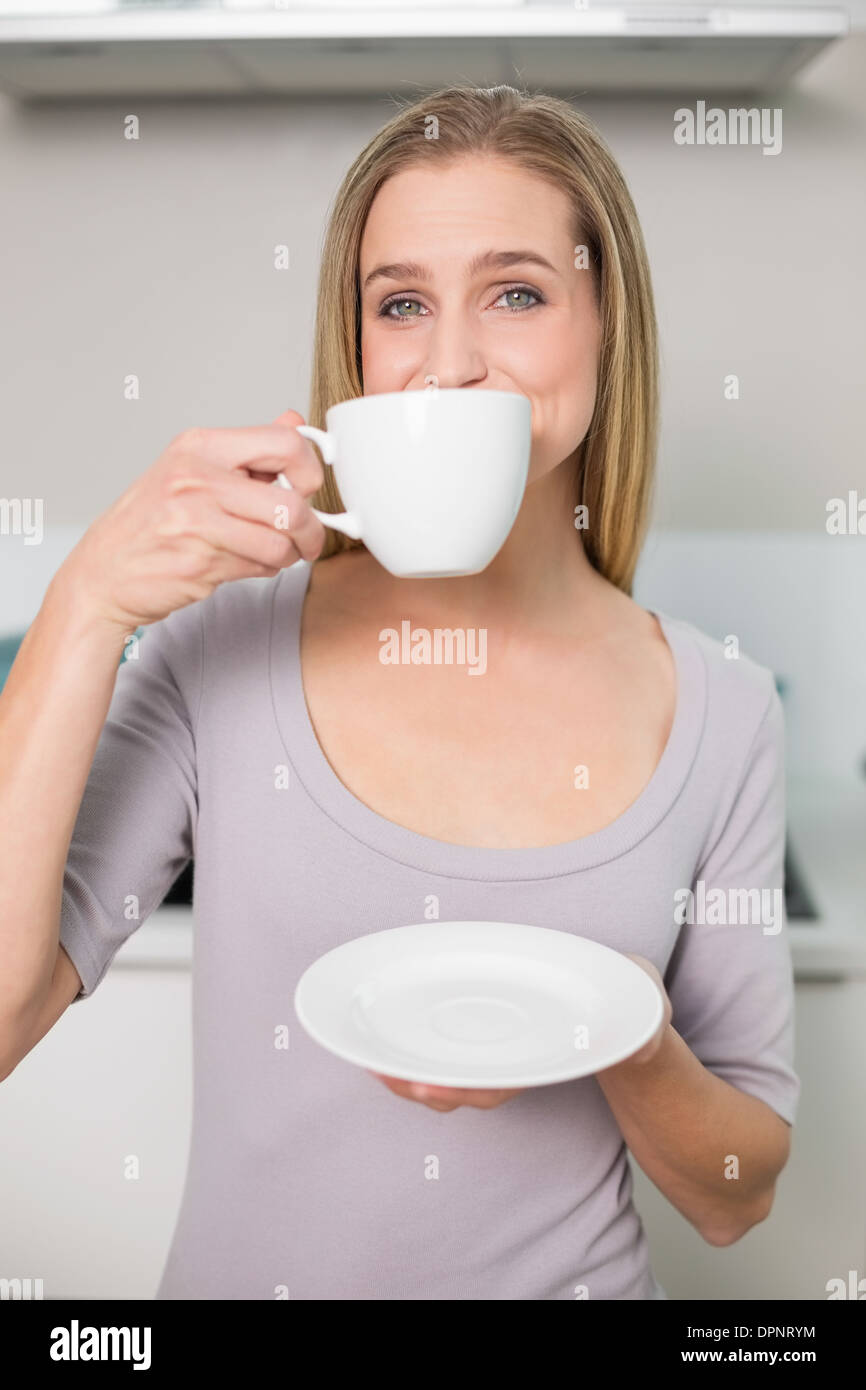 Happy gorgeous model holding plate with cup Stock Photo - Alamy