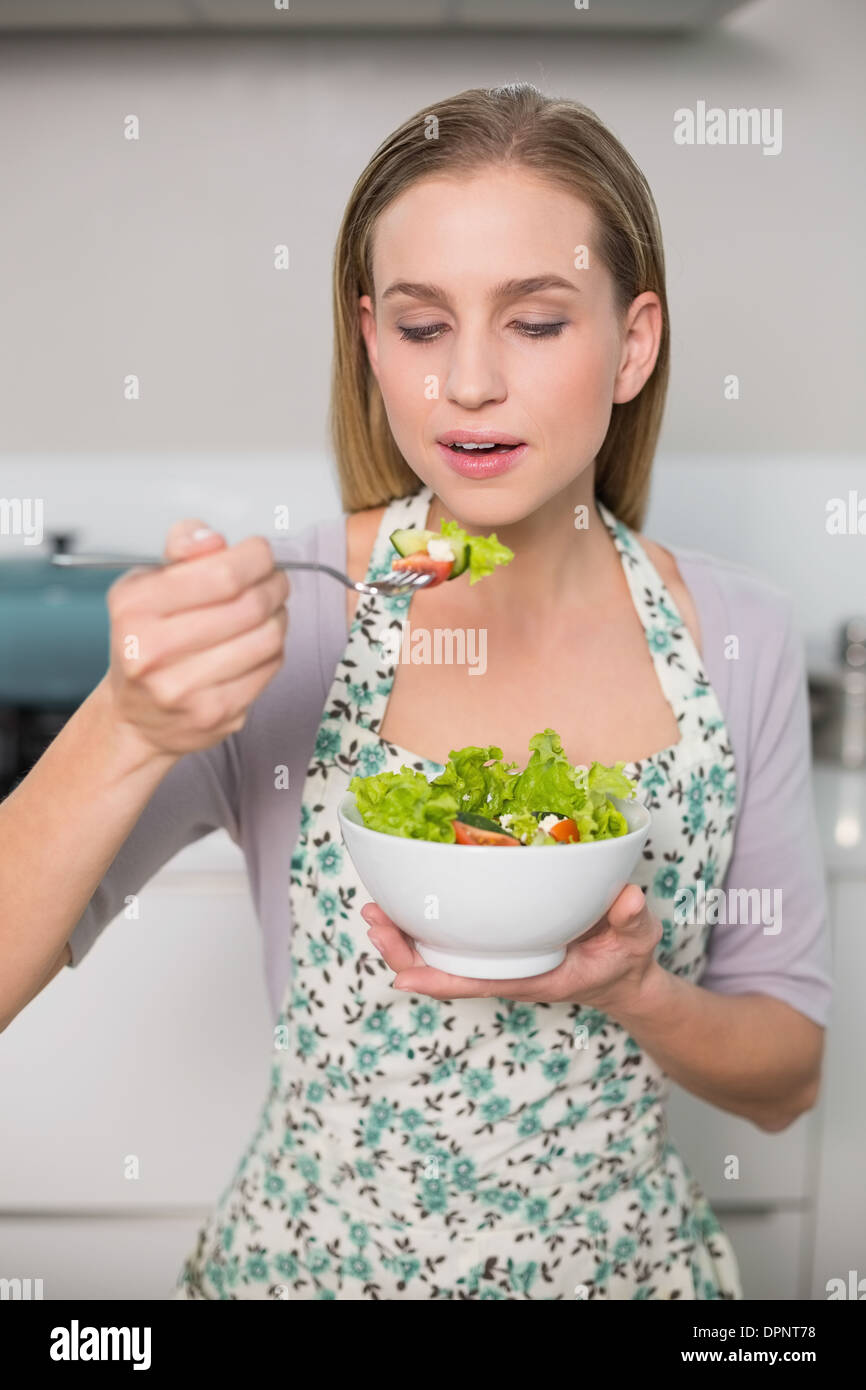 Happy gorgeous model eating salad Stock Photo - Alamy