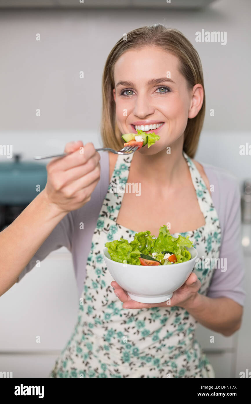 Happy gorgeous model eating salad hi-res stock photography and images ...