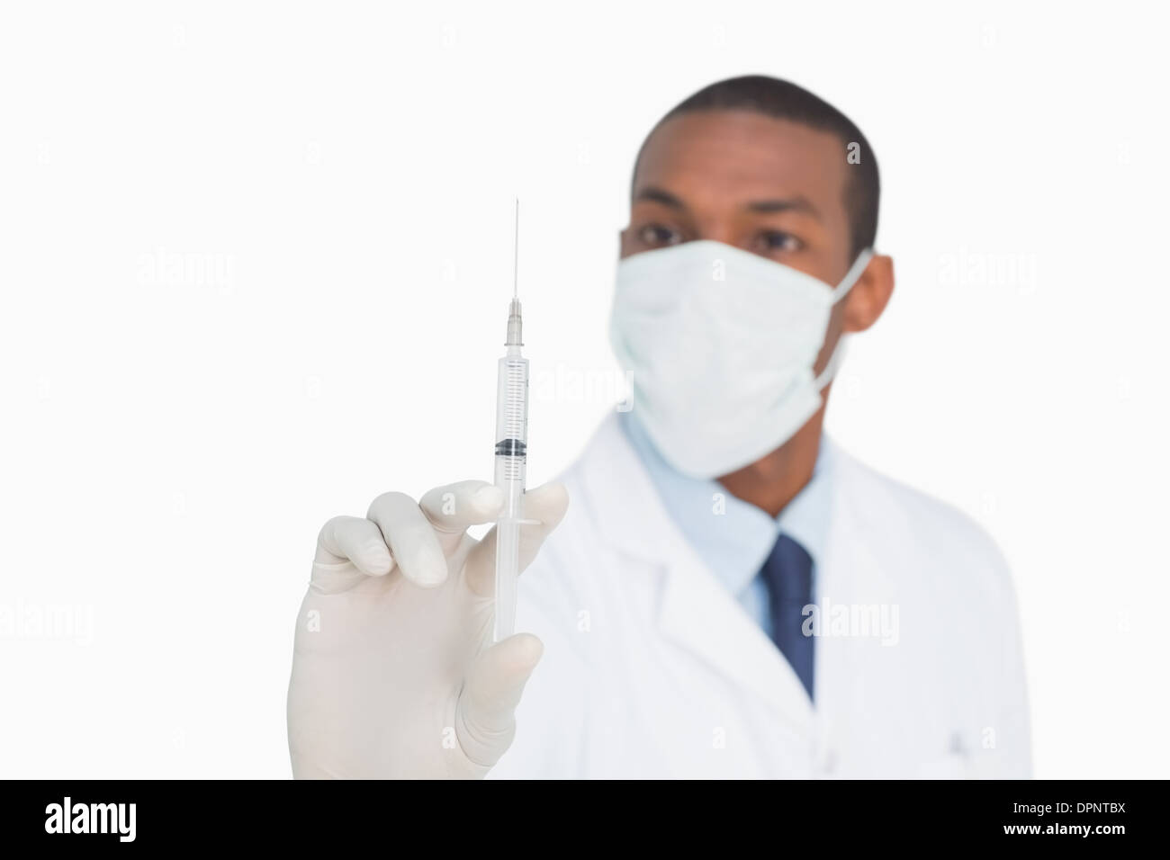 Black doctor holding syringe hi-res stock photography and images - Alamy
