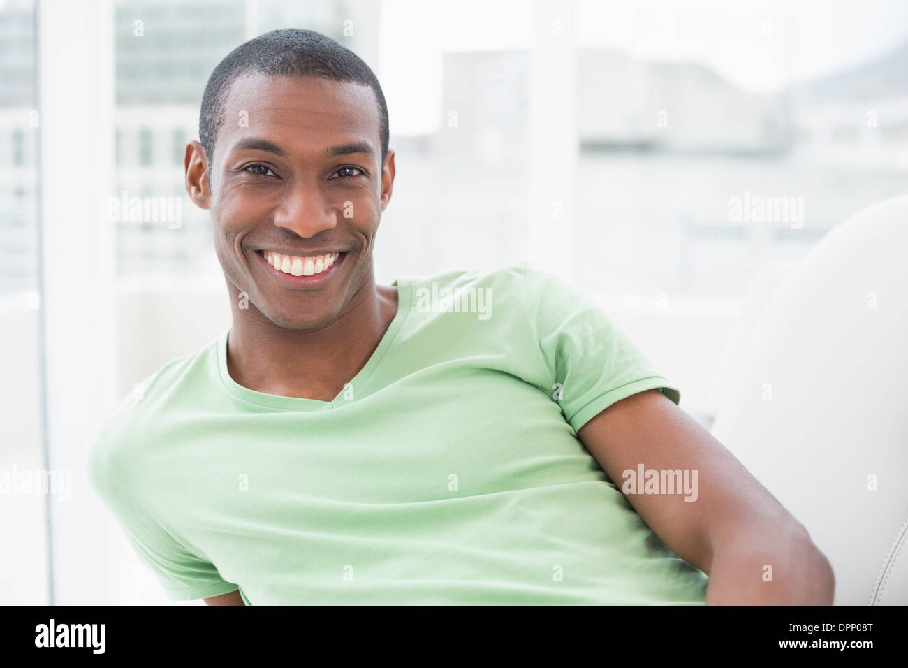Portrait of a relaxed smiling young Afro man Stock Photo - Alamy