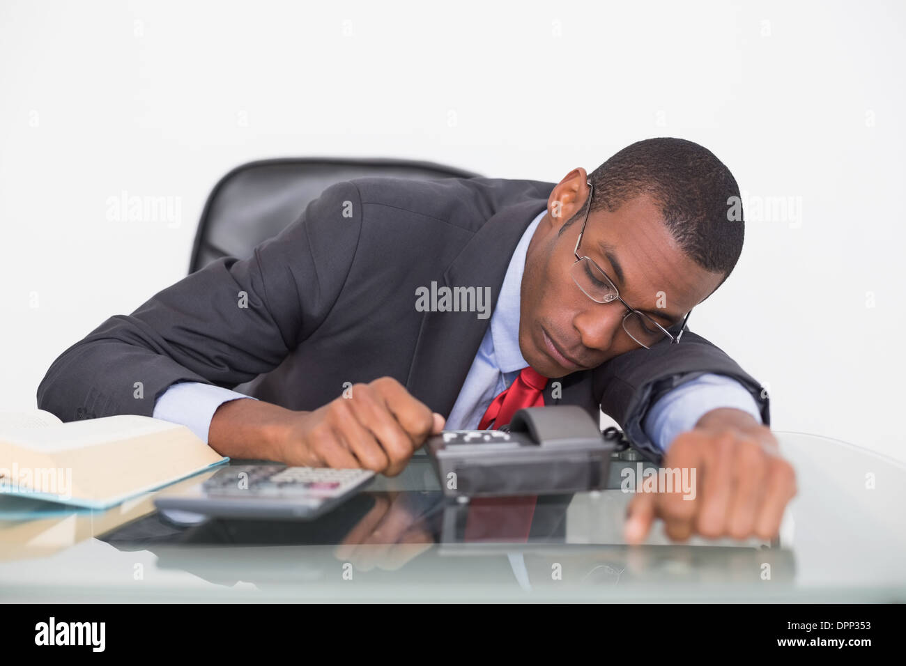 Afro businessman resting at desk over white background Stock Photo - Alamy