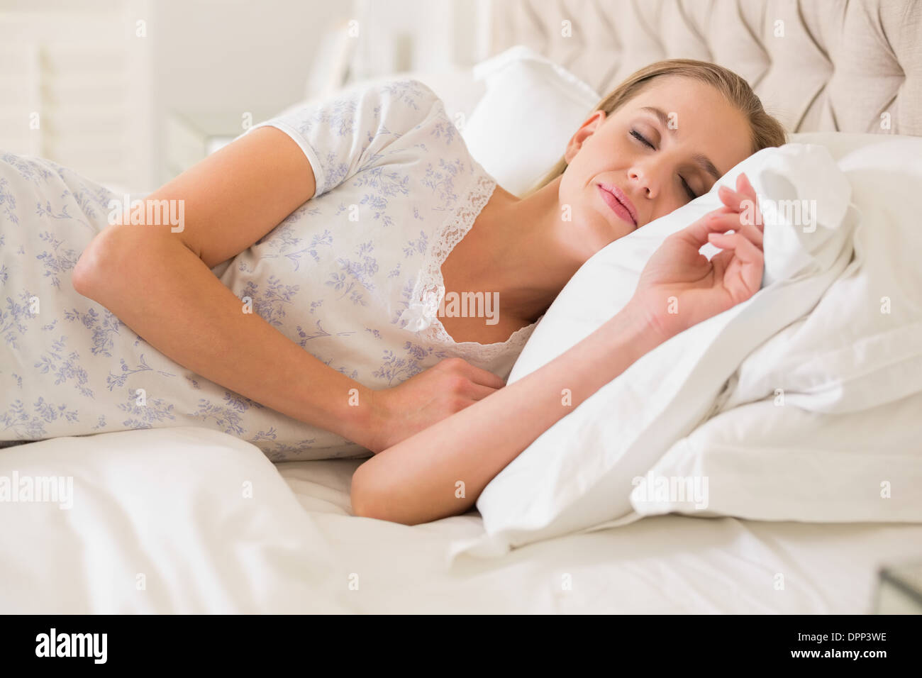 Natural peaceful woman sleeping in bed Stock Photo - Alamy