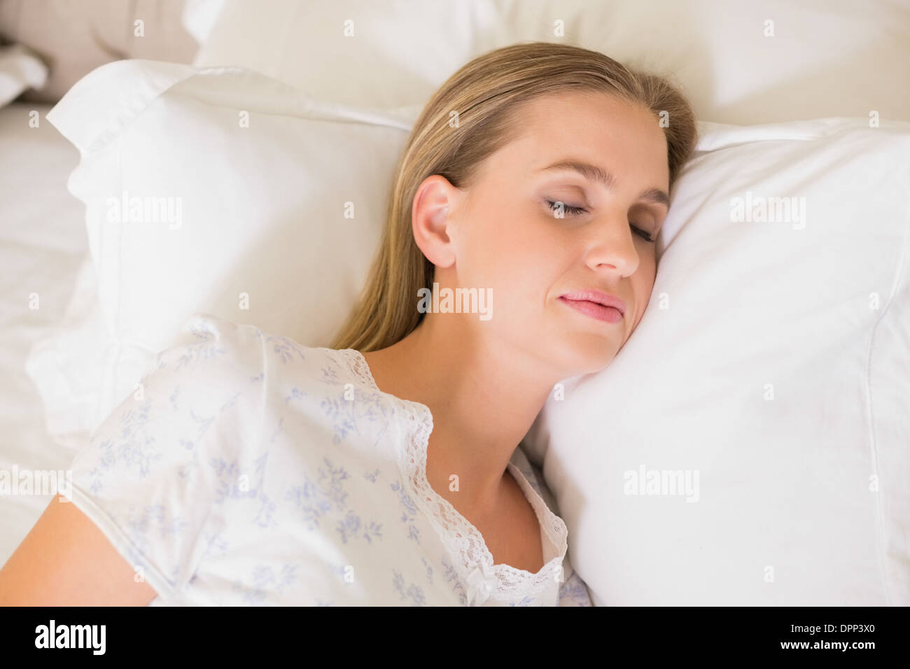 Natural content woman sleeping in bed Stock Photo - Alamy