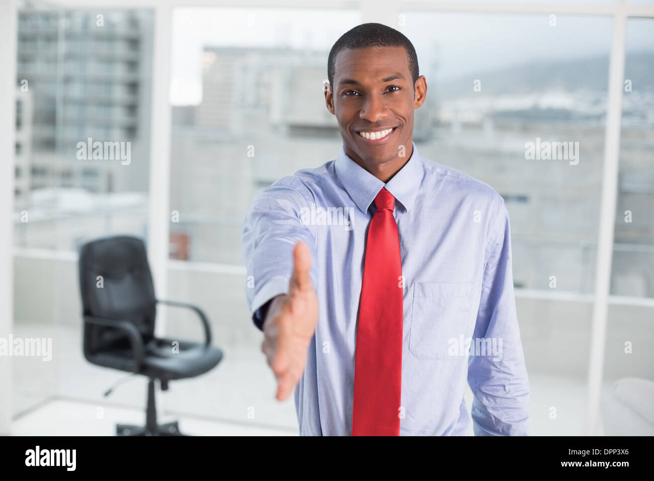 Elegant smiling Afro businessman offering handshake at office Stock ...