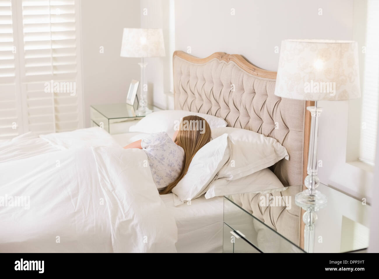 Natural woman sleeping in bed Stock Photo - Alamy