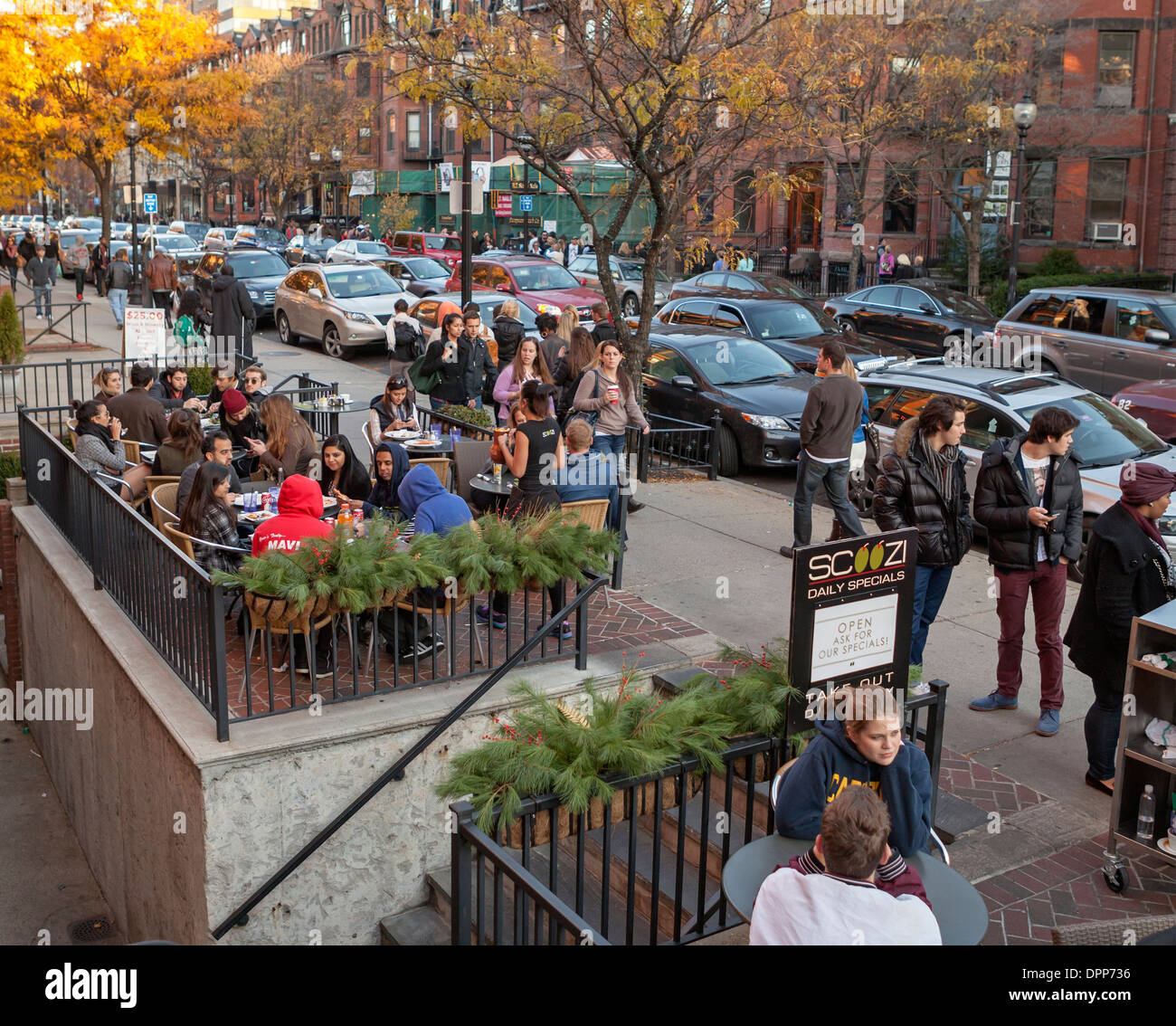 People eat outside at a restaurant on Newbury Street in Boston Stock ...