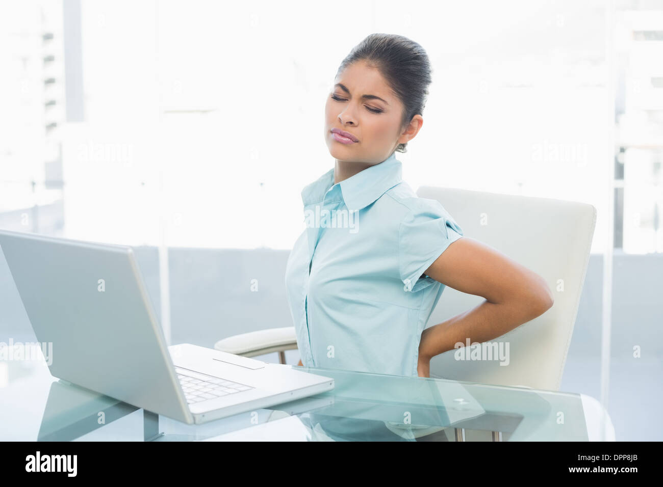 Woman back ache office desk hi-res stock photography and images - Alamy
