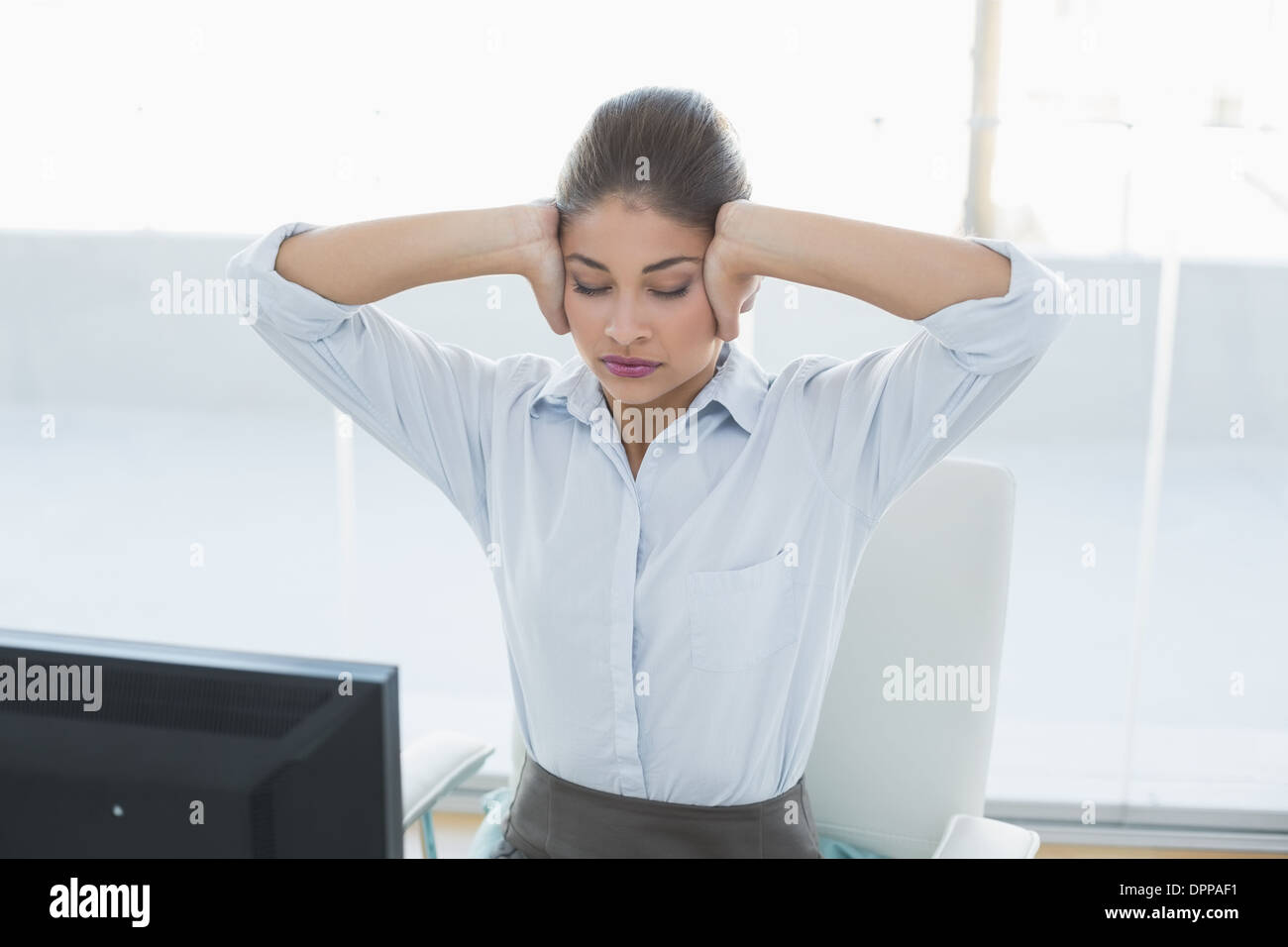 Businesswoman suffering from headache at office Stock Photo - Alamy