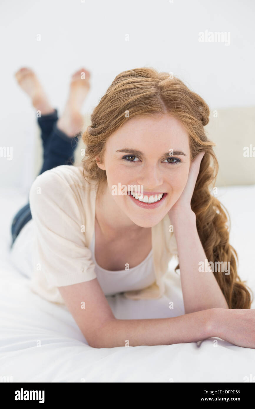 Portrait of a pretty young woman in bed Stock Photo - Alamy