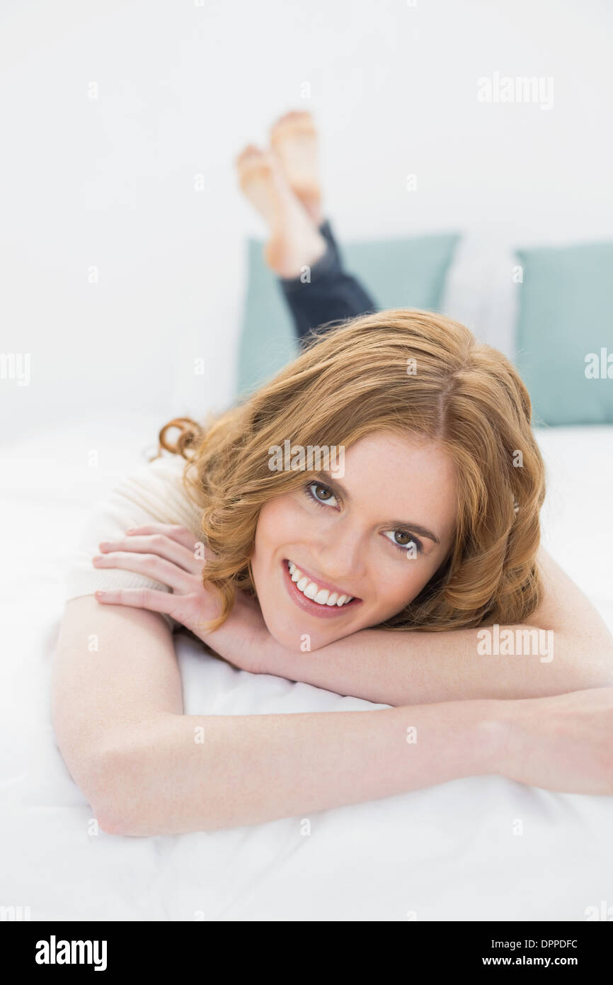 Portrait of a smiling pretty woman in bed Stock Photo - Alamy