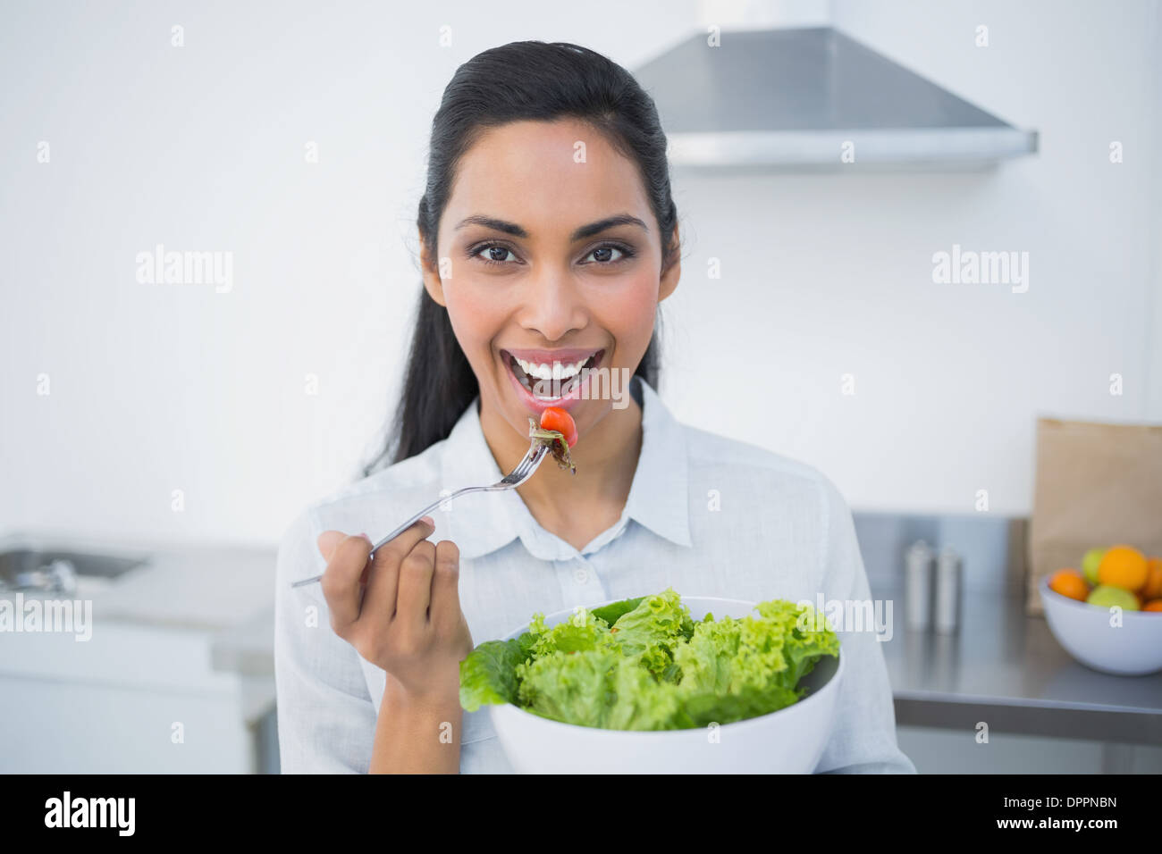 Happy woman eating salad hi-res stock photography and images - Alamy