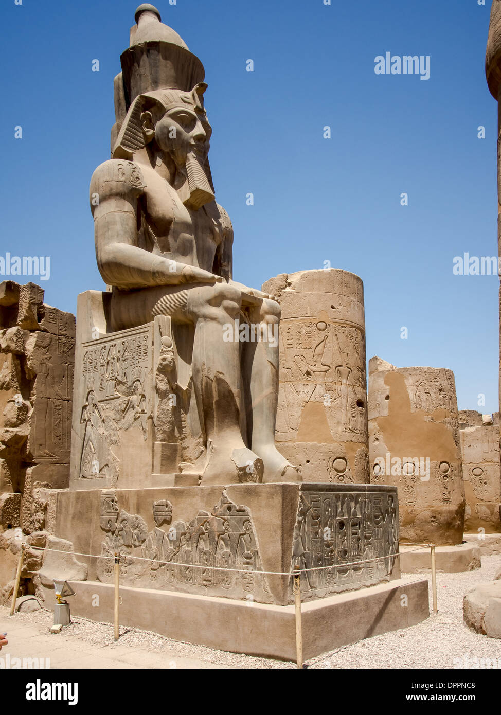 One of two seated statues of Rameses II that guard the first Pylon to ...