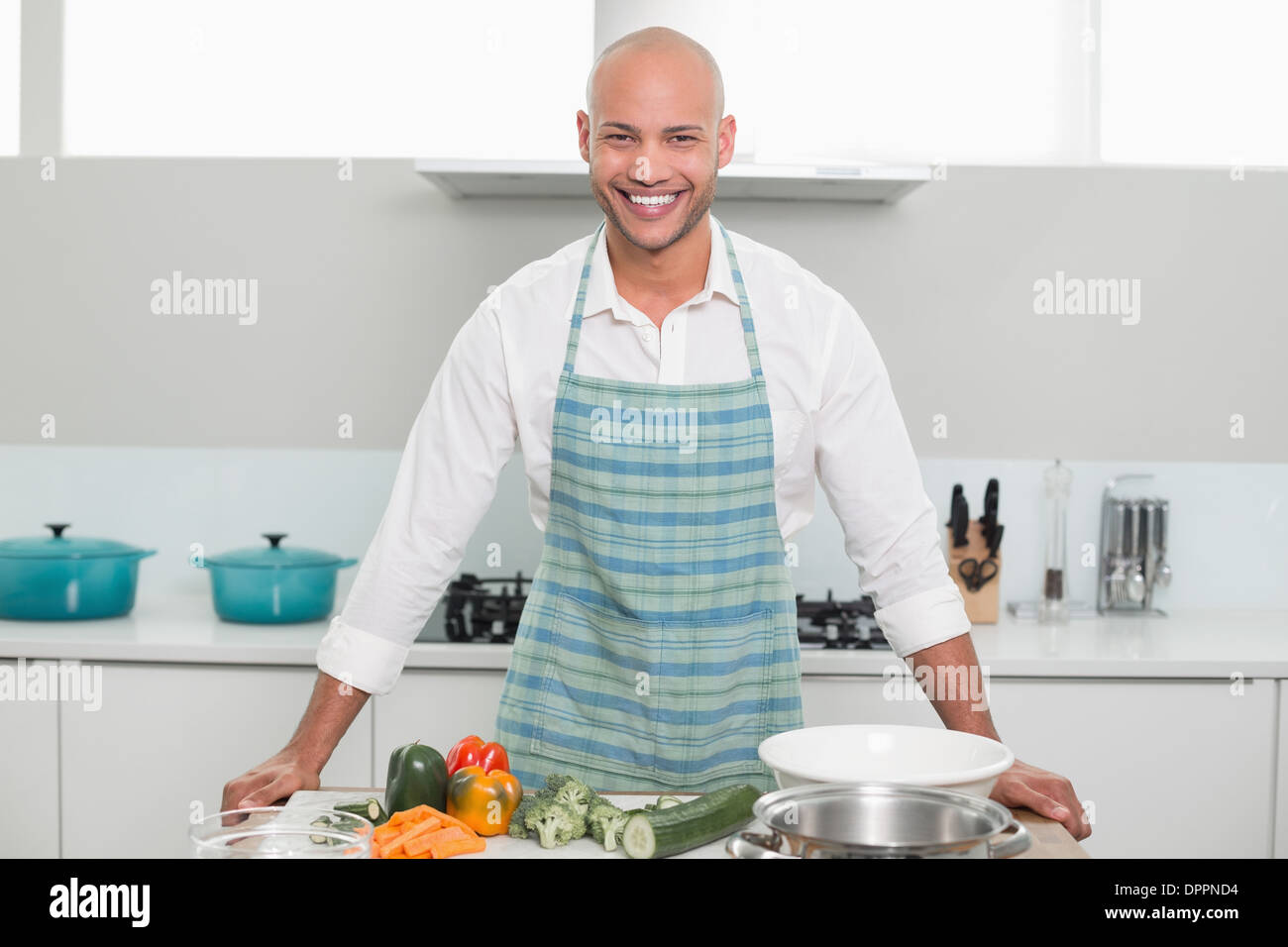 Young smiling man in kitchen hi-res stock photography and images - Alamy