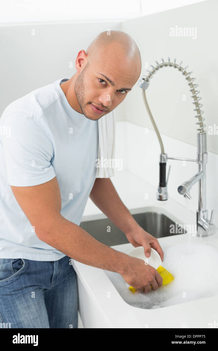 Man wash dishes hi-res stock photography and images - Alamy