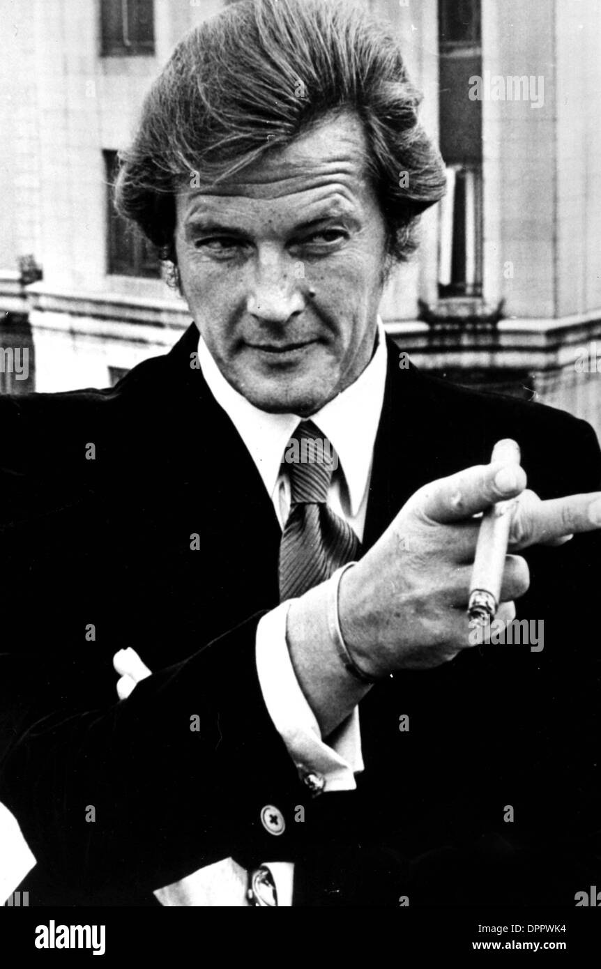 Roger moore credit Black and White Stock Photos & Images - Alamy